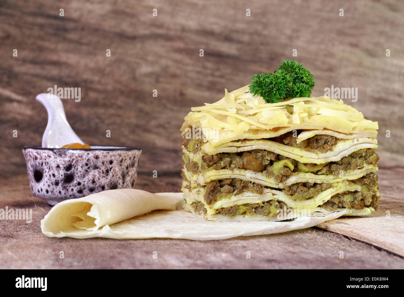 South African bobotie dish layered with pancakes Stock Photo - Alamy
