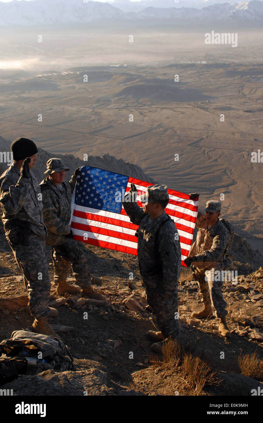 Capt. Michael Riha re-enlists Staff Sgt. Robby Ragos of Plainfield, Ill ...