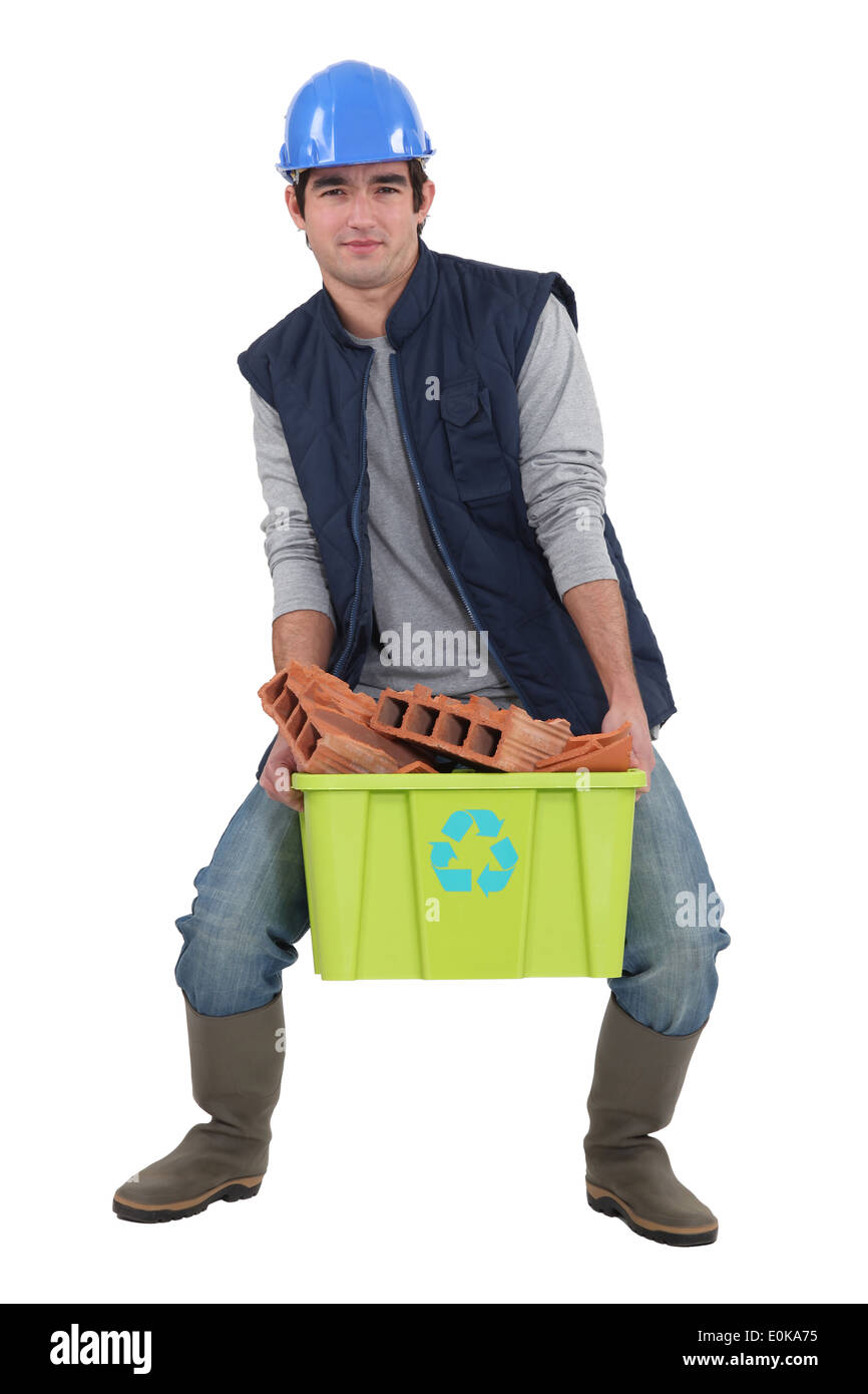 Man recycling bricks Stock Photo - Alamy