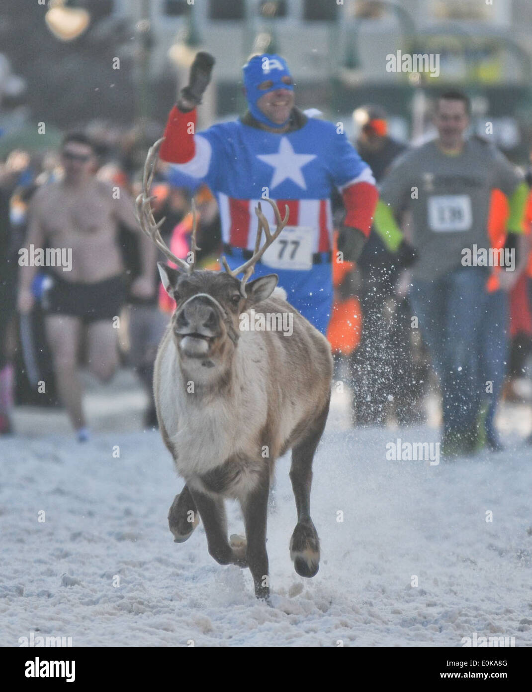 A man dressed as Captain America participates in the Running of the ...
