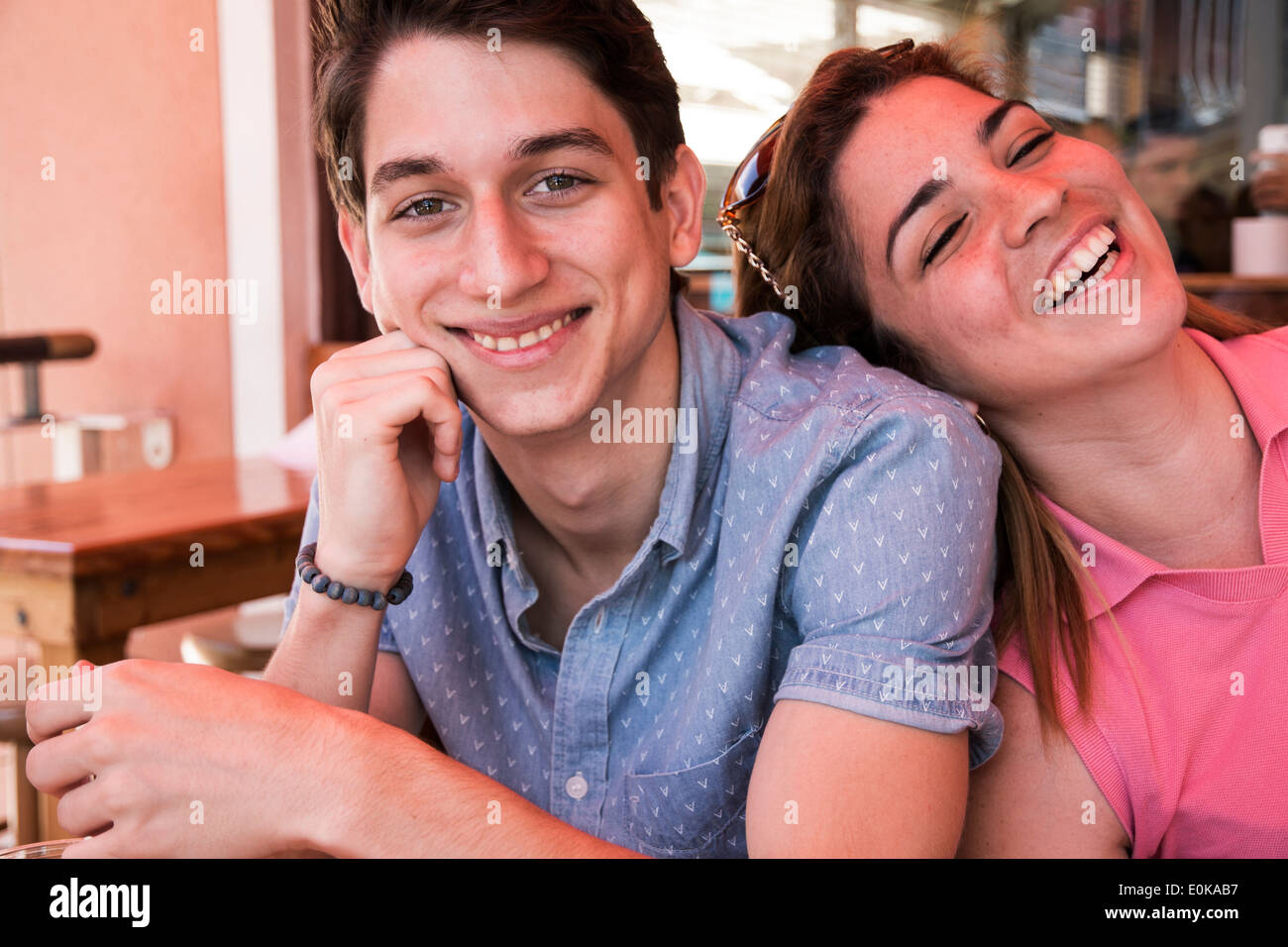 Two teenagers laughing indoors hi-res stock photography and images - Alamy
