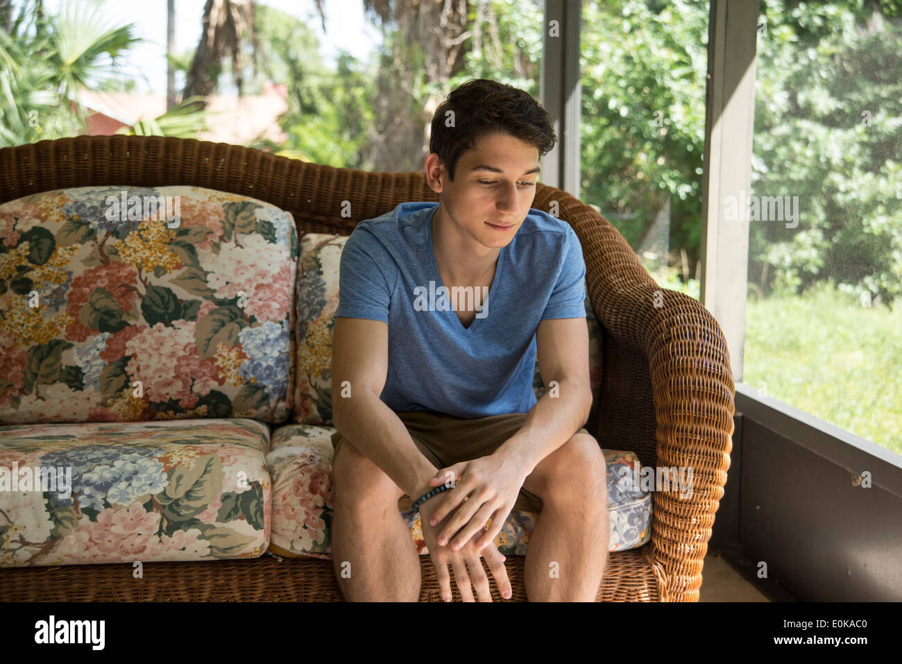Young man alone at home Stock Photo - Alamy