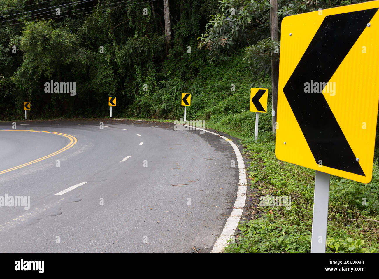 Sign curves road on the way at the mountain Stock Photo - Alamy