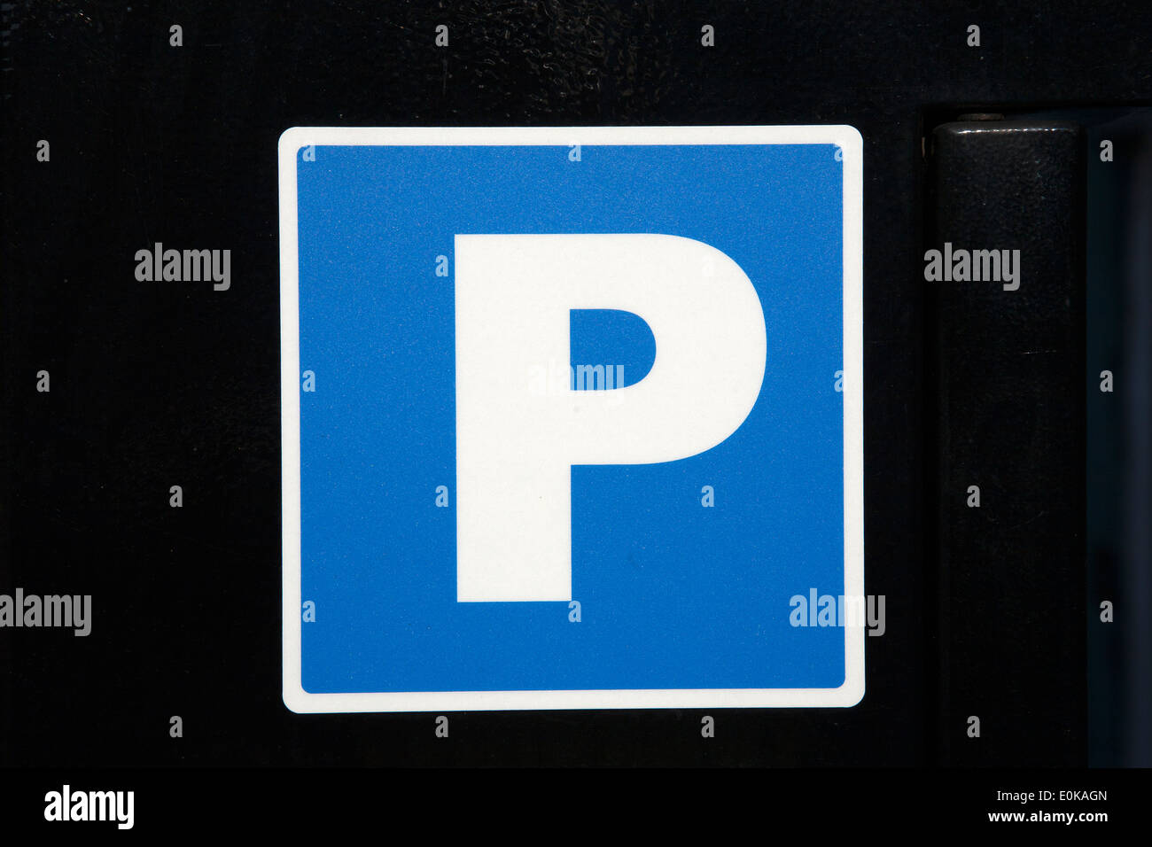 Blue Parking Sign against Black Background Stock Photo - Alamy