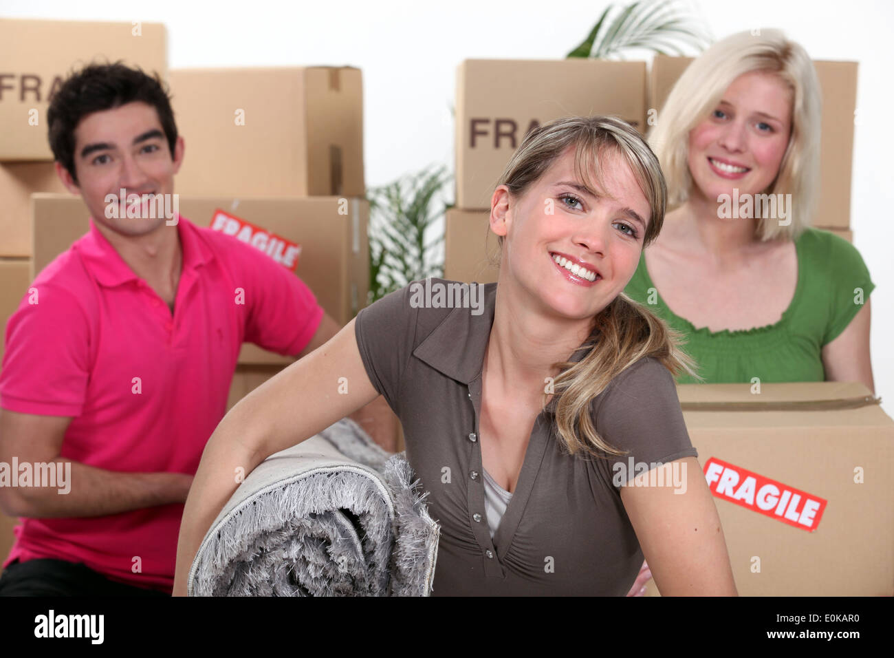Young people moving house Stock Photo - Alamy