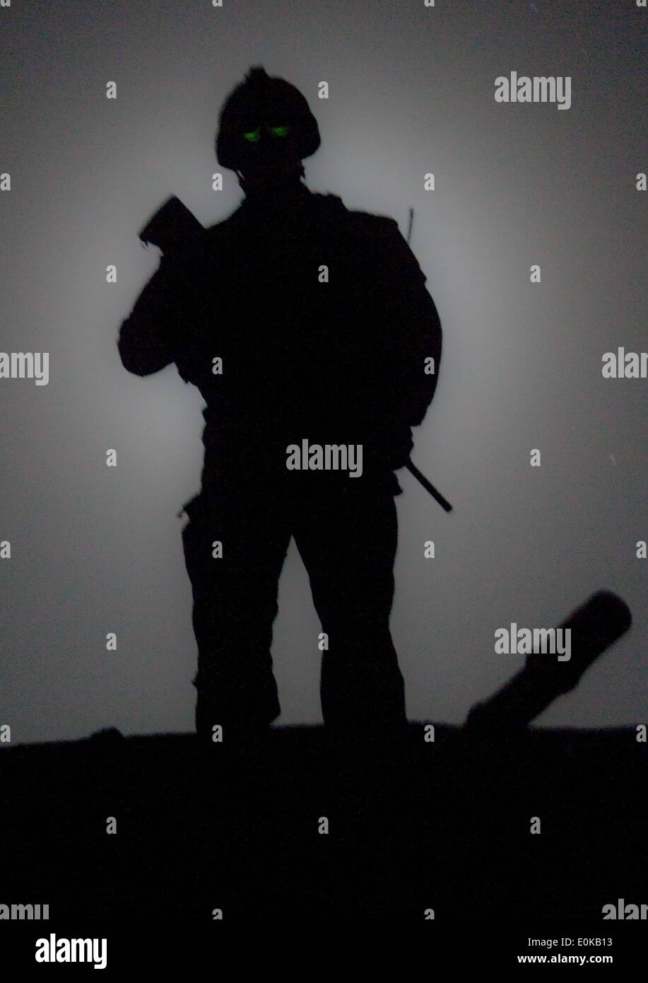 A member of an Afghan-international security force pulls security while ...