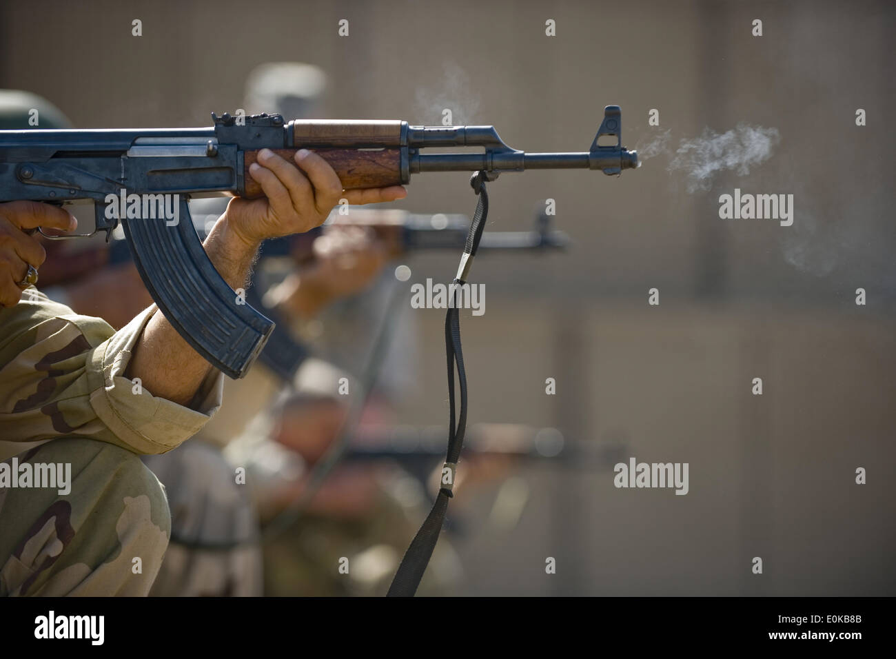 Iraqi airmen fire AK-47s during firing drills March 29. Members of the ...
