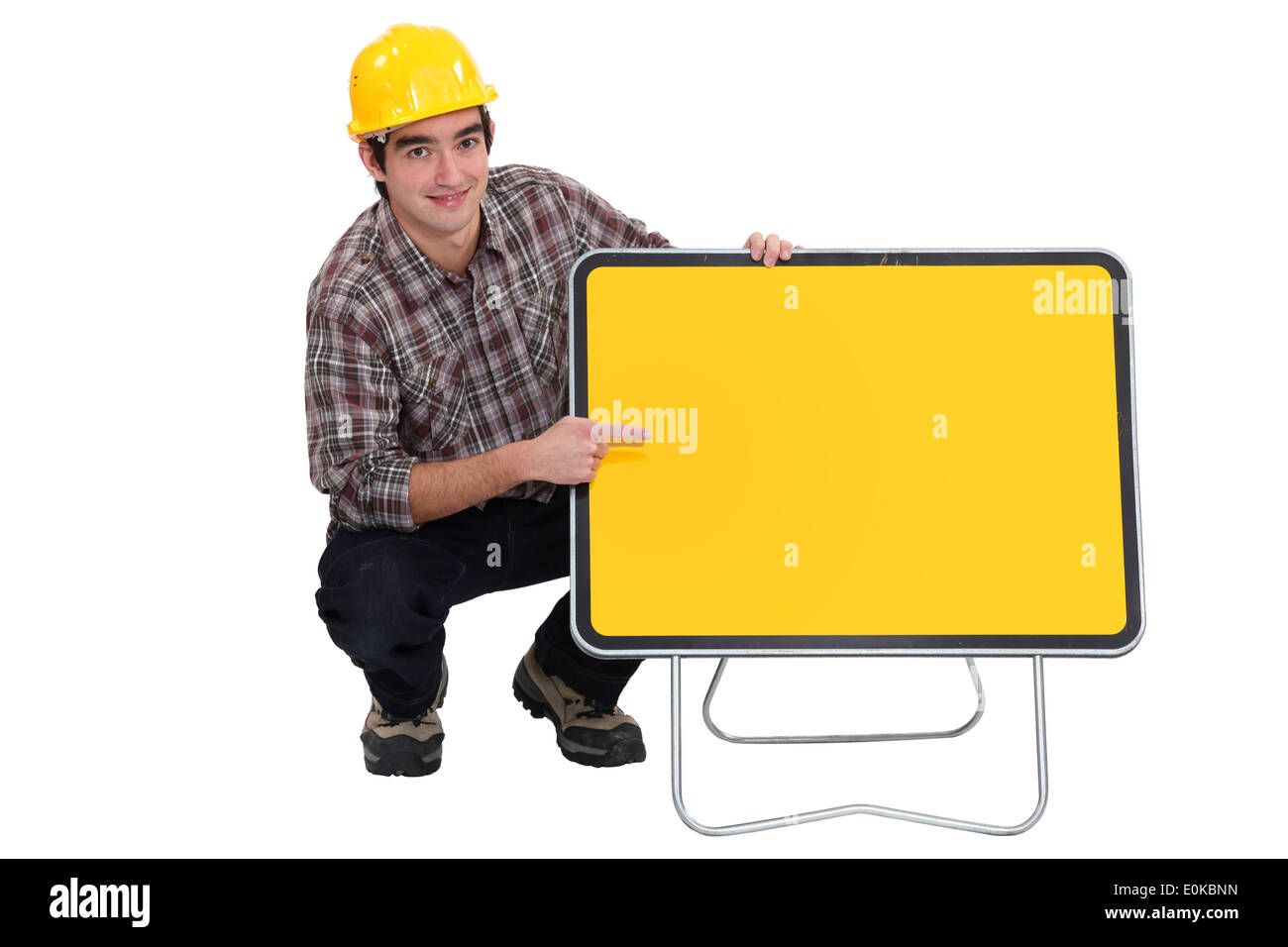 Man pointing at traffic sign Stock Photo - Alamy