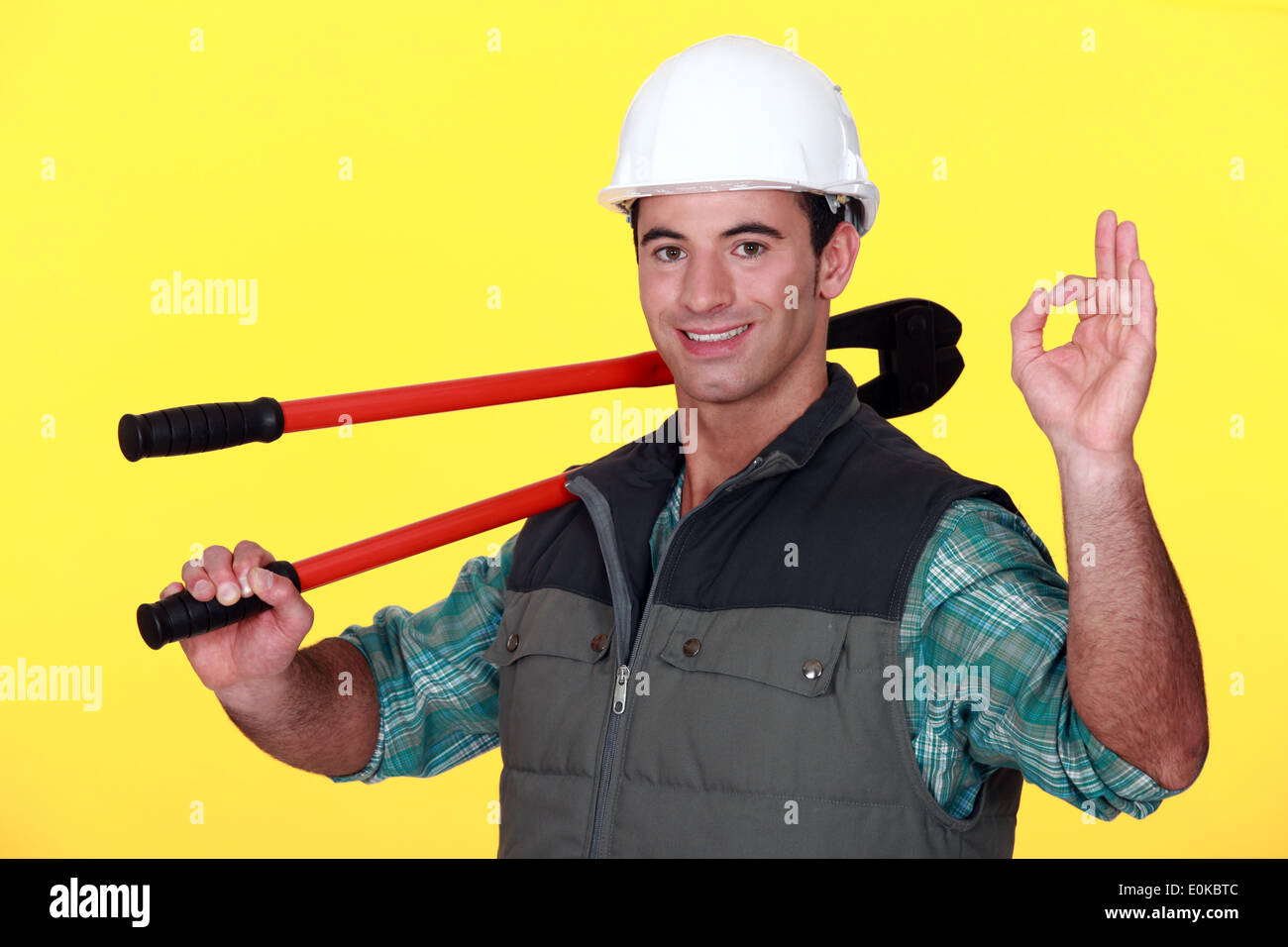 Man with bolt-cutters giving the OK sign Stock Photo - Alamy