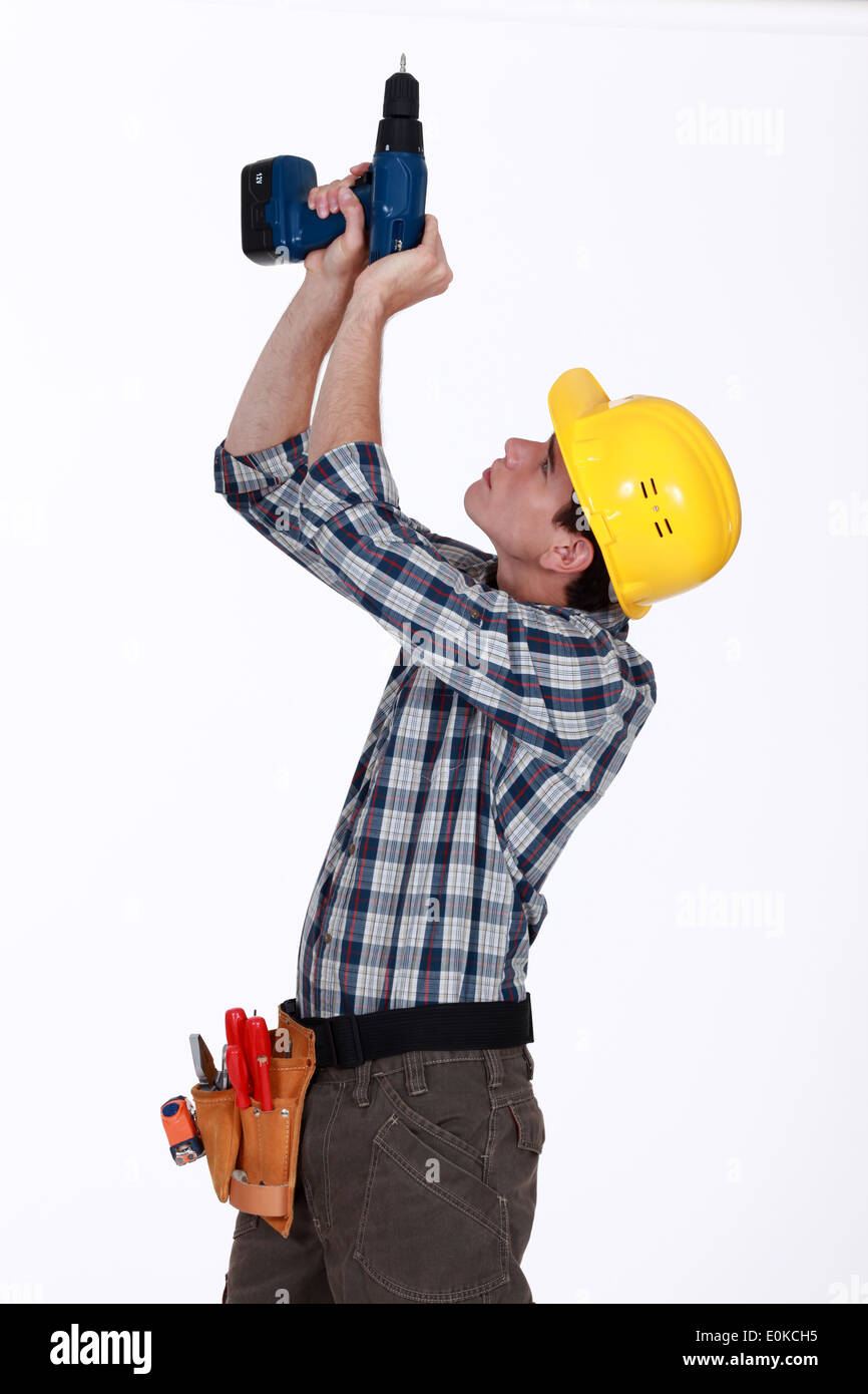 Young man with a cordless screwdriver Stock Photo - Alamy