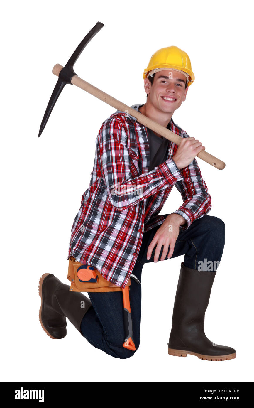 Young worker with a pickaxe Stock Photo - Alamy