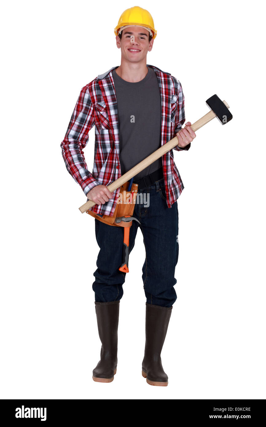 Worker holding sledge-hammer Stock Photo - Alamy