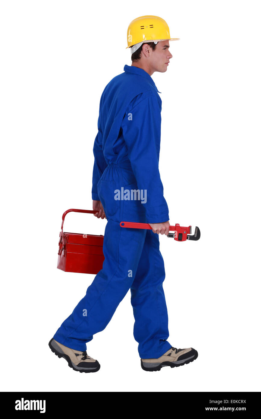 plumber walking with toolbox and spanner Stock Photo - Alamy