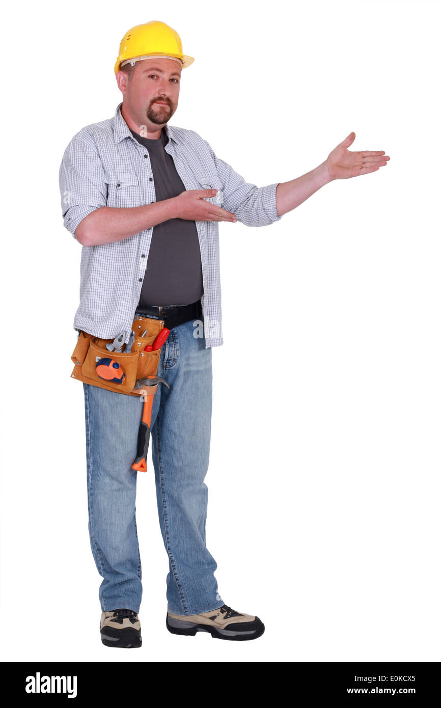 Laborer gesturing on white background Stock Photo - Alamy