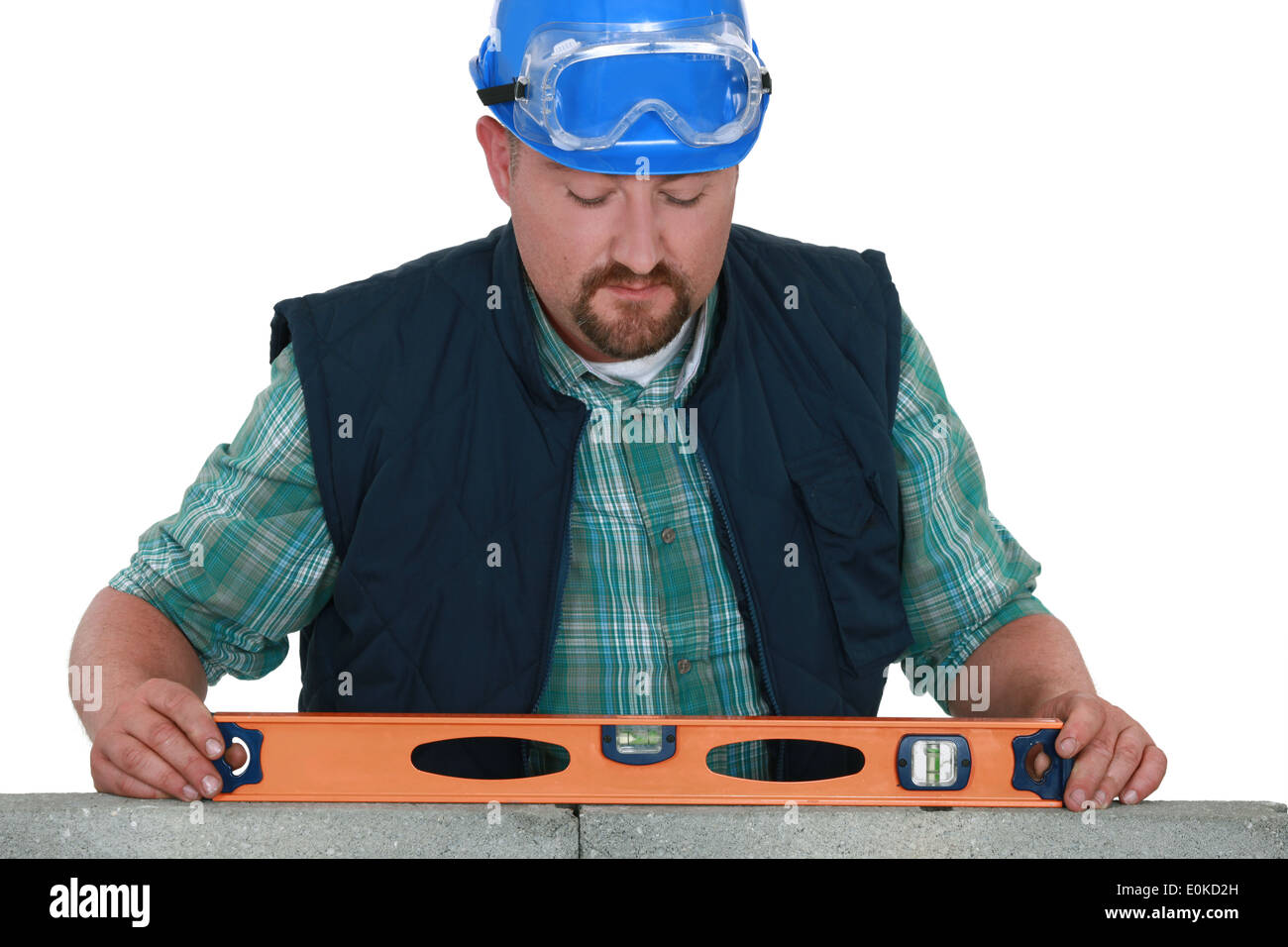 Bricklayer taking measurements Stock Photo - Alamy