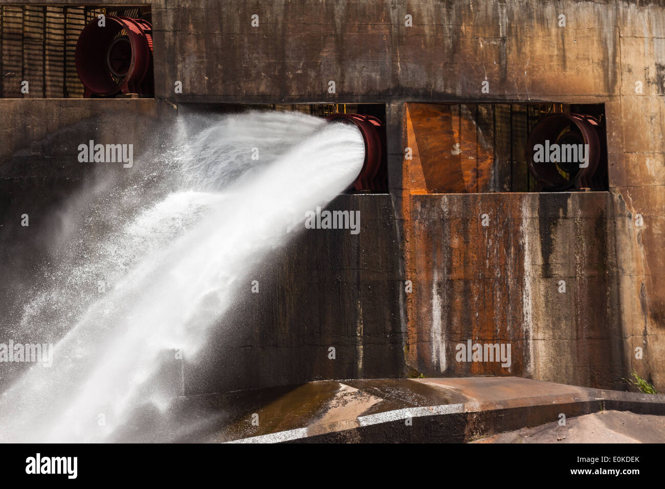 Dam Wall structure with rain water flowing sleuth gate into river ...