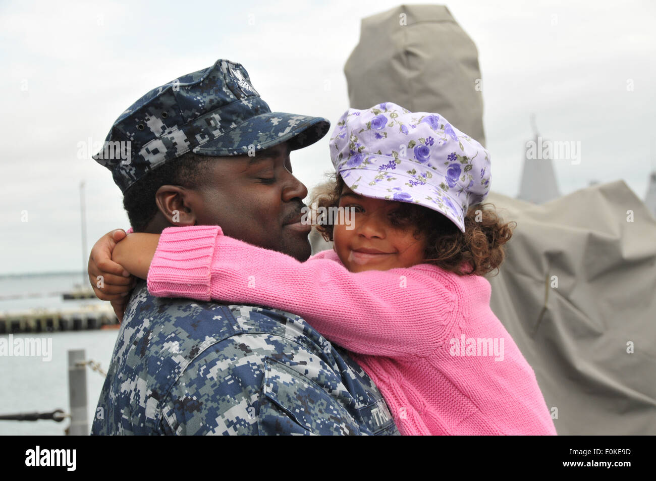 Petty Officer 1st Class Rodney Thomas, fire controlman, holds his ...