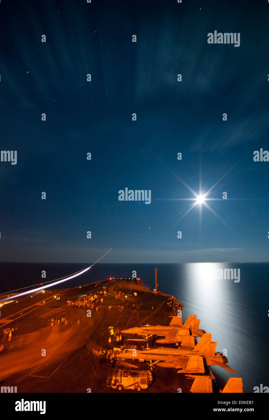 The Nimitz-class aircraft carrier USS Carl Vinson conducts night flight ...