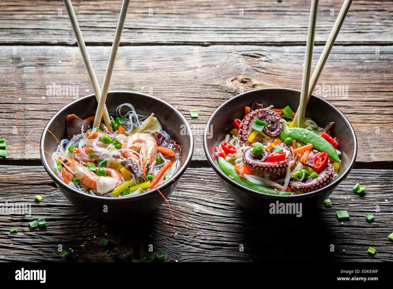 Two dishes with vegetables and seafood Stock Photo - Alamy
