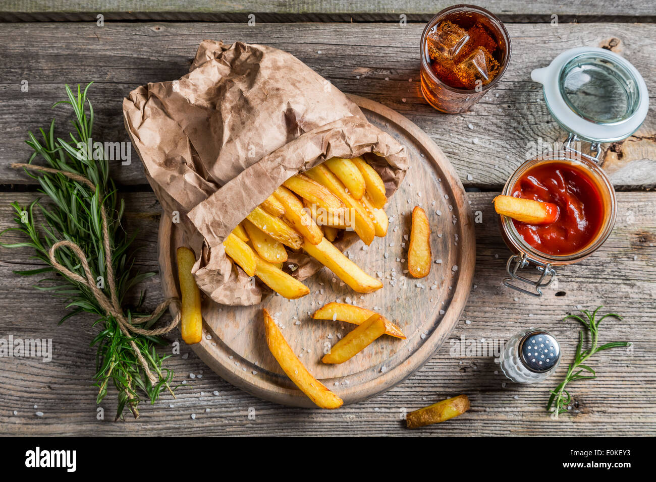 Homemade fries served with cold drink Stock Photo - Alamy