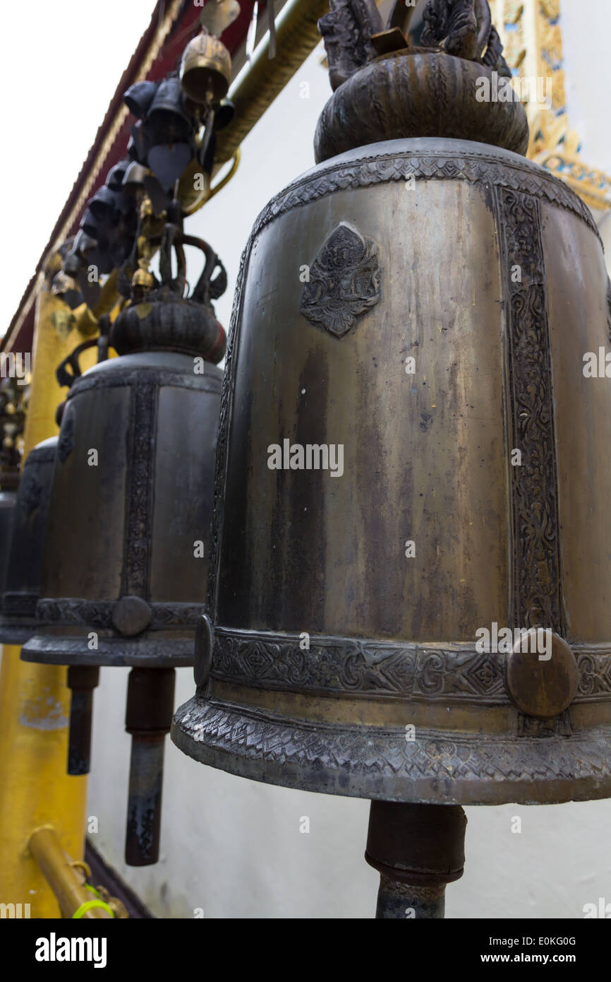 Hanging bell. Large black bell hanging in rows on a steel beam Stock ...