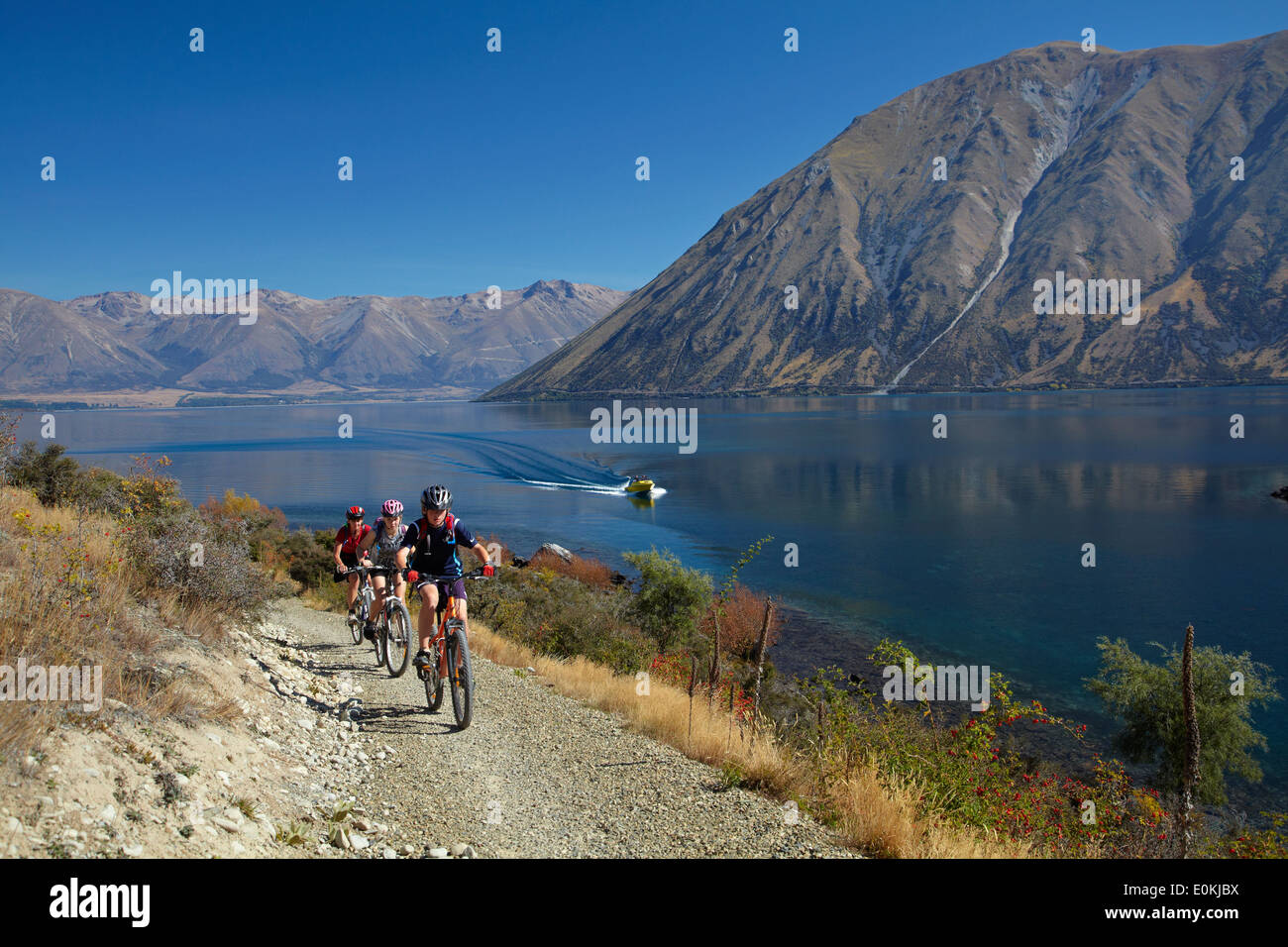 Cyclists on Alps 2 Ocean cycle trail, Lake Ohau and Ben Ohau, Mackenzie ...