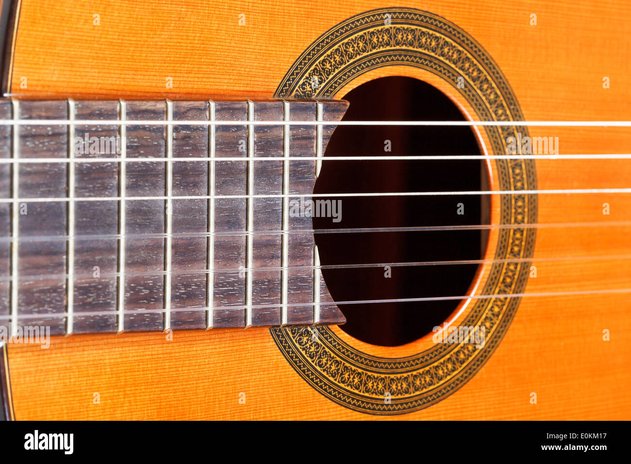 fingerboard and sound hole of classical acoustic guitar with six nylon ...
