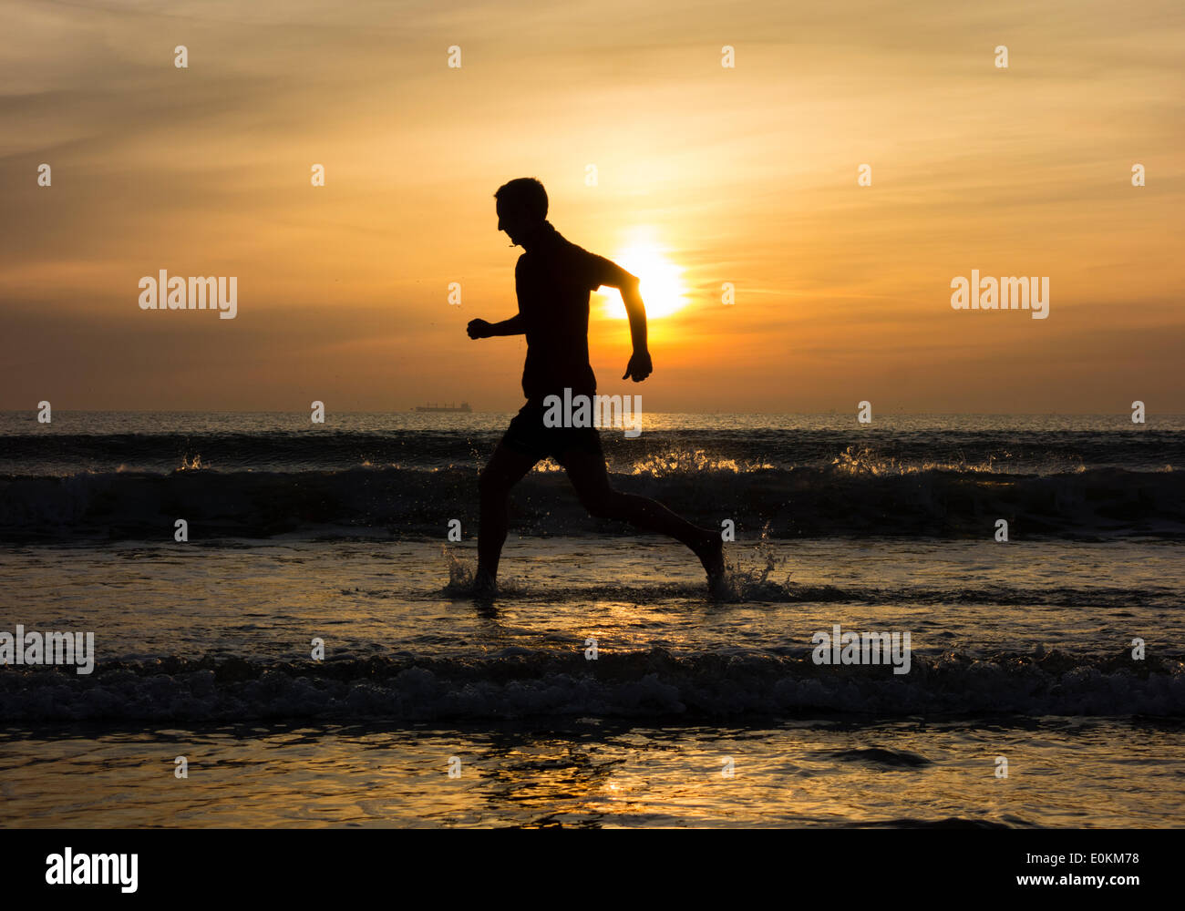 Man running barefoot in sea hi-res stock photography and images - Alamy