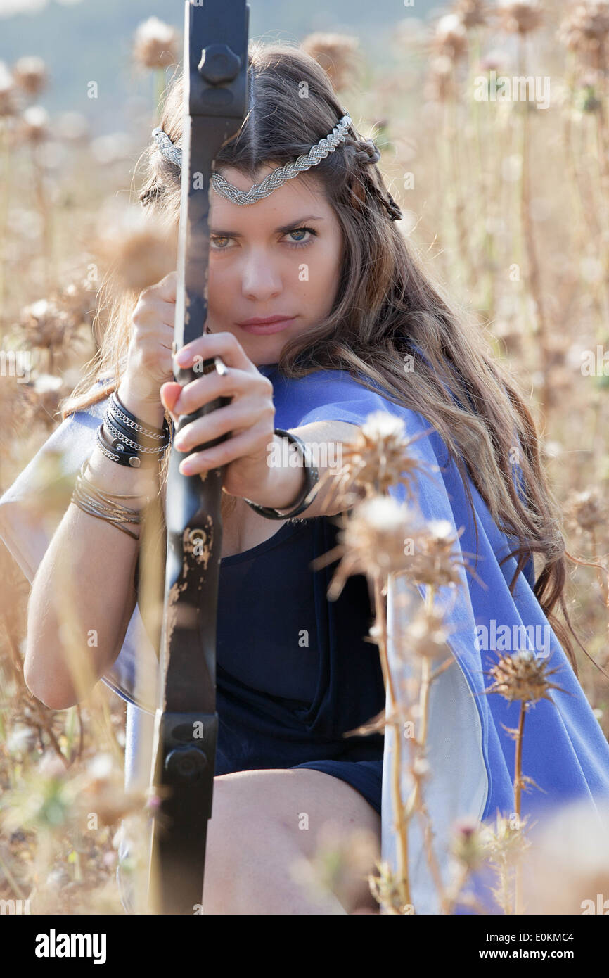 Woman firing bow hi-res stock photography and images - Alamy