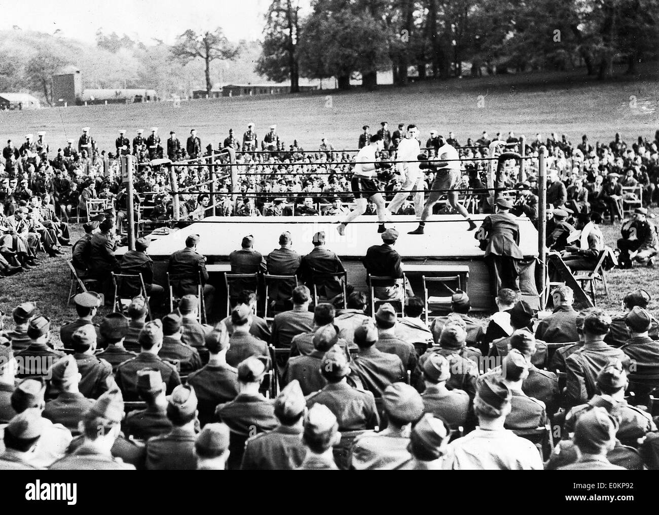 Joe Louis spars with Sergeant George Robinson to entertain the troops ...