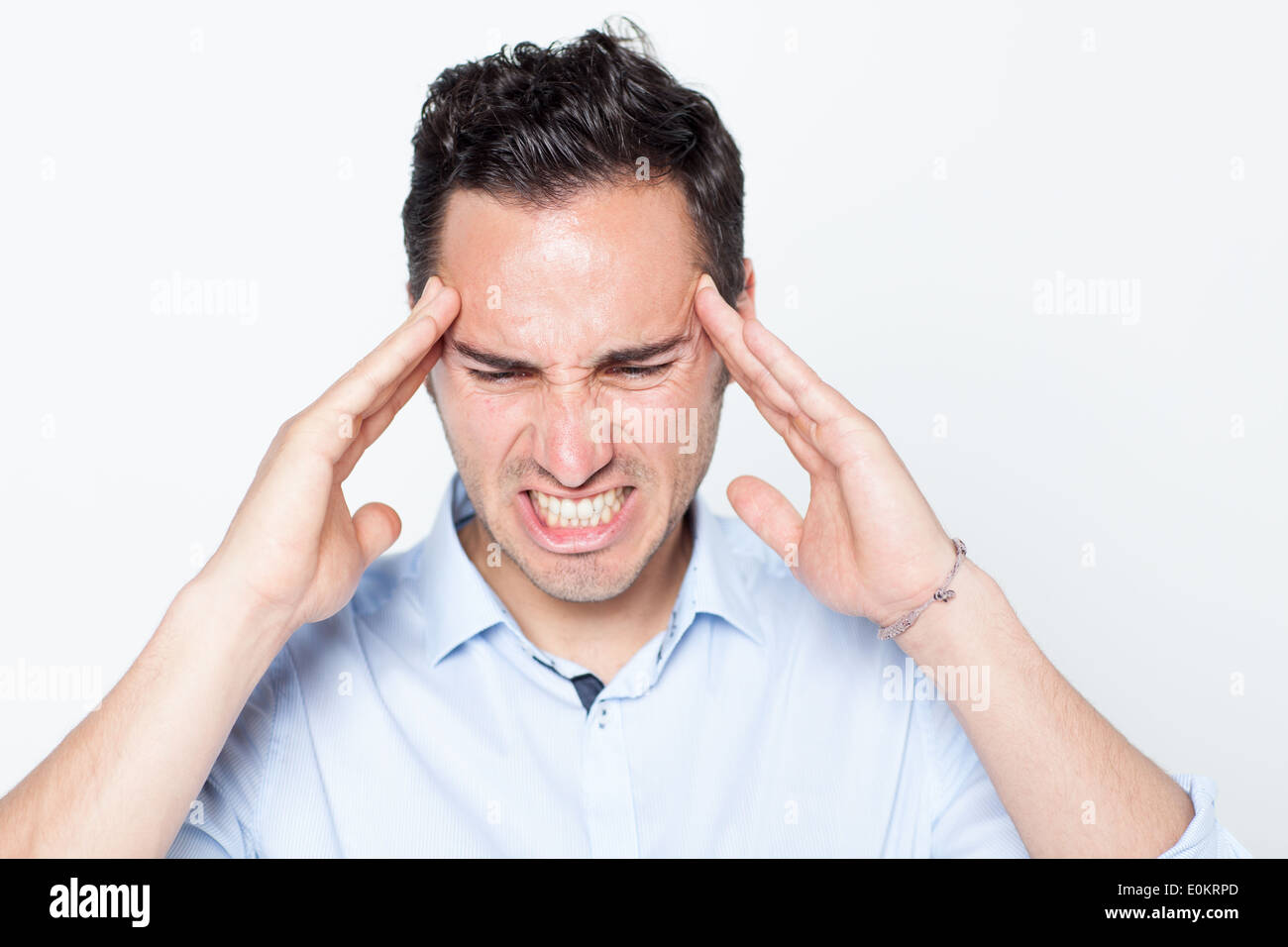 Man suffering from headache Stock Photo - Alamy