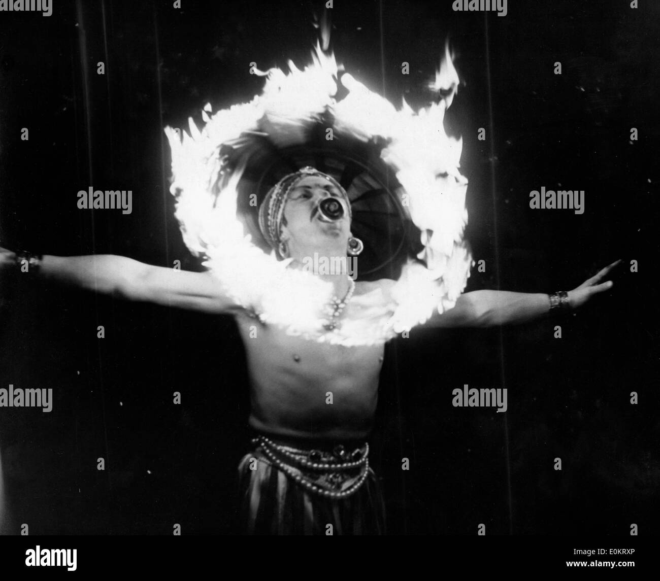 Tagora, the fire eater performing at the Empire Pool Stock Photo - Alamy