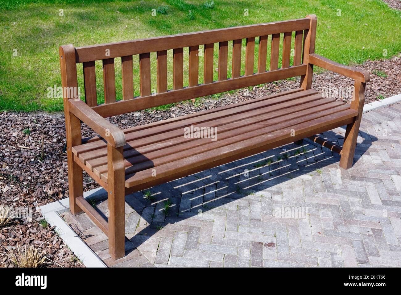 Wooden yellow bench in public city park. Sunny day Stock Photo - Alamy