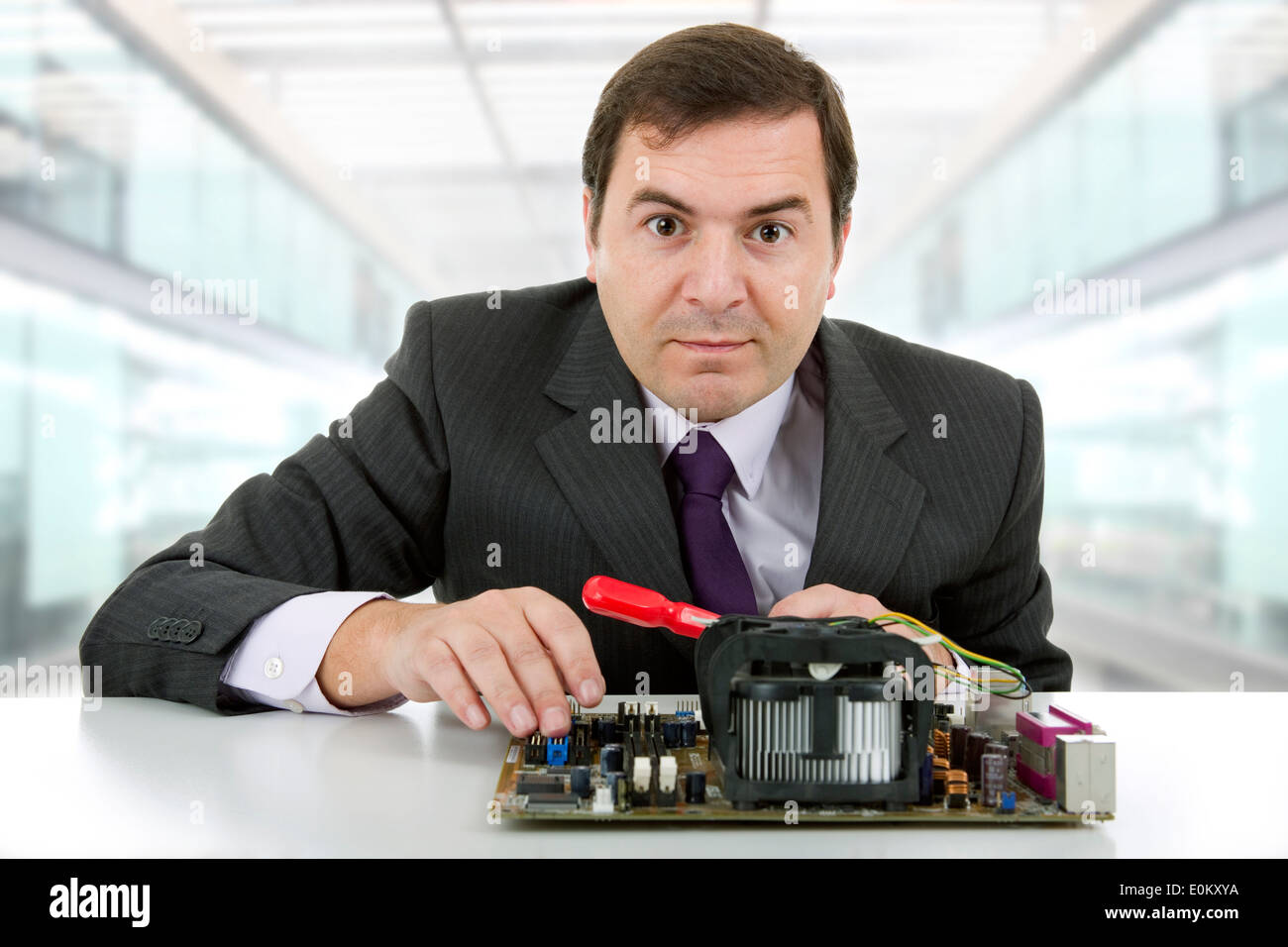 Computer Engineer working in a motherboard at the office Stock Photo ...