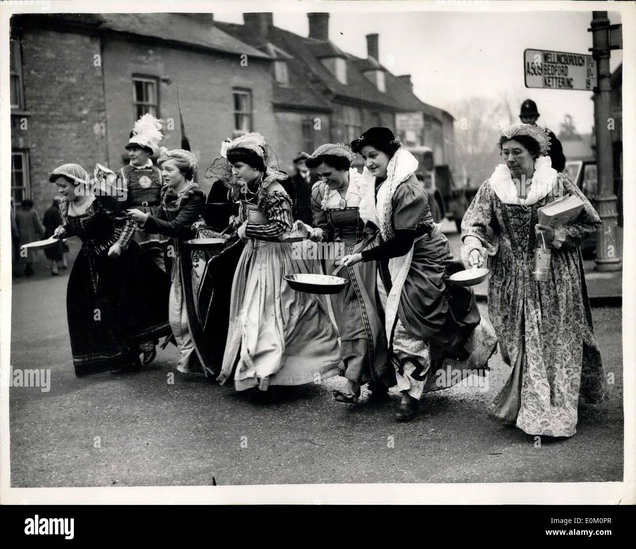 Feb. 17, 1953 - Annual Olney (Bucks) Pancake race. Isobel Dix does the ...