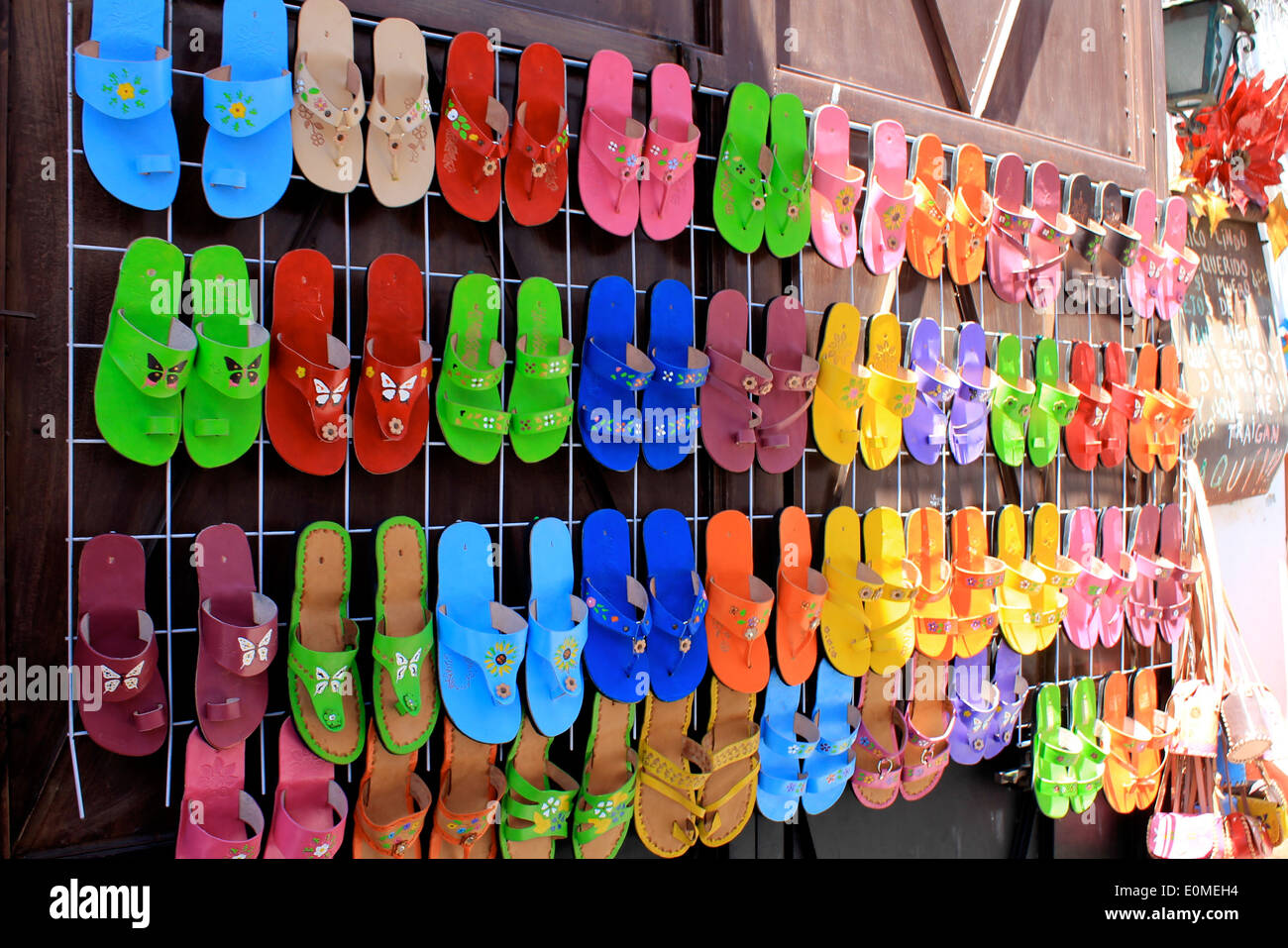 Colourful display of sandals outside a shop in Taxco, Guerrero, Mexico ...