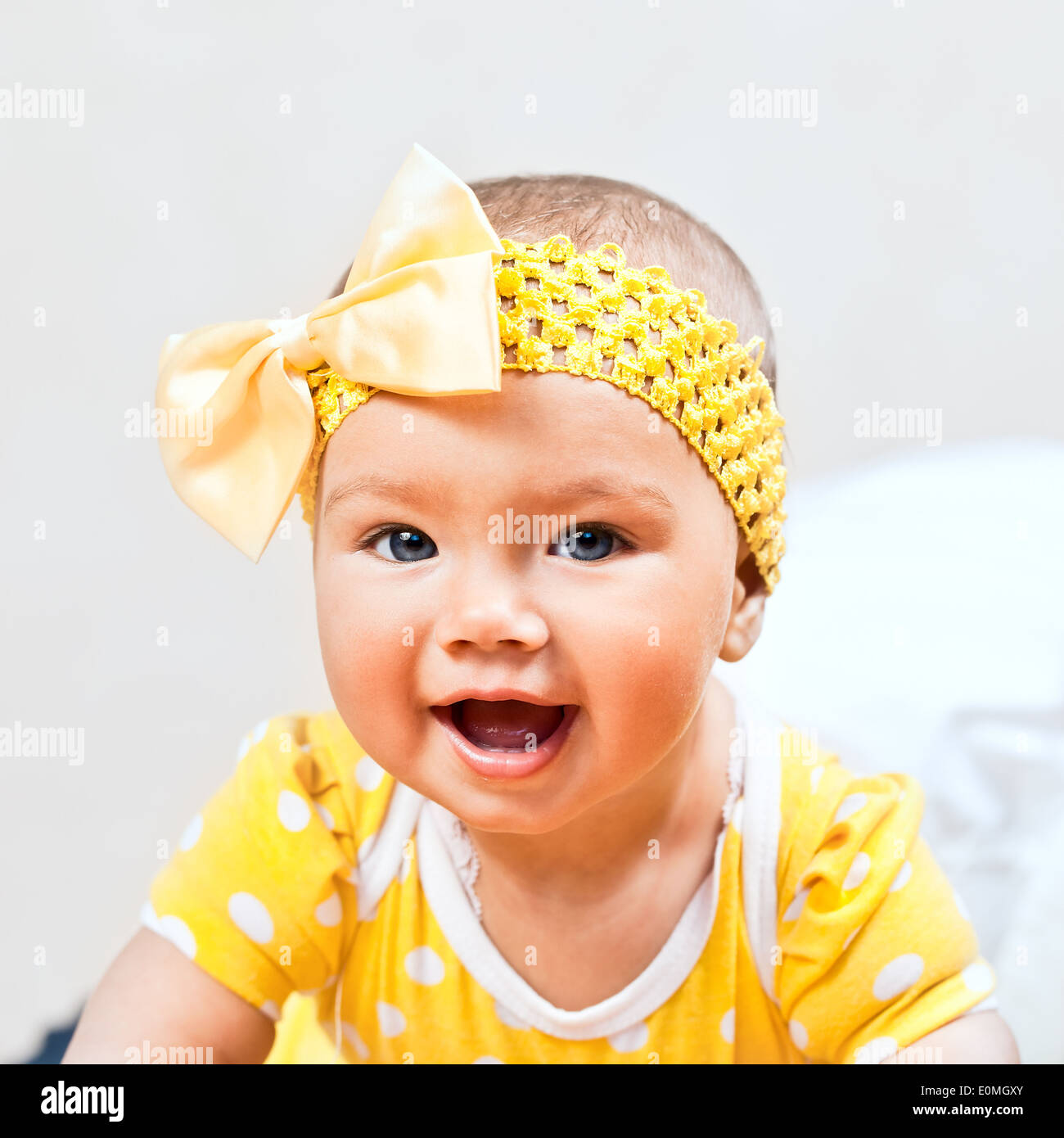 happy little girl in yellow dress Stock Photo - Alamy