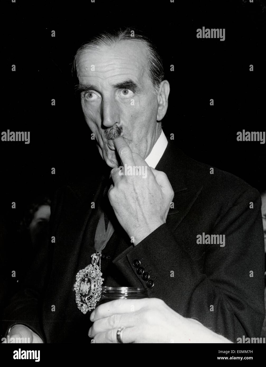 Sir Rupert De La Bere tastes honey Stock Photo - Alamy