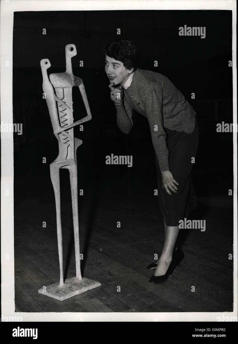 Feb. 02, 1956 - SCULPTURE EXHIBITION PRIVATE VIEW.. YOUNG LADY EXAMINES ...