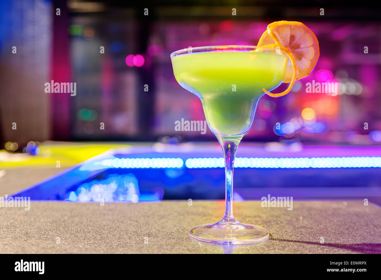 cocktail at bar in a night club with vivid colors Stock Photo - Alamy