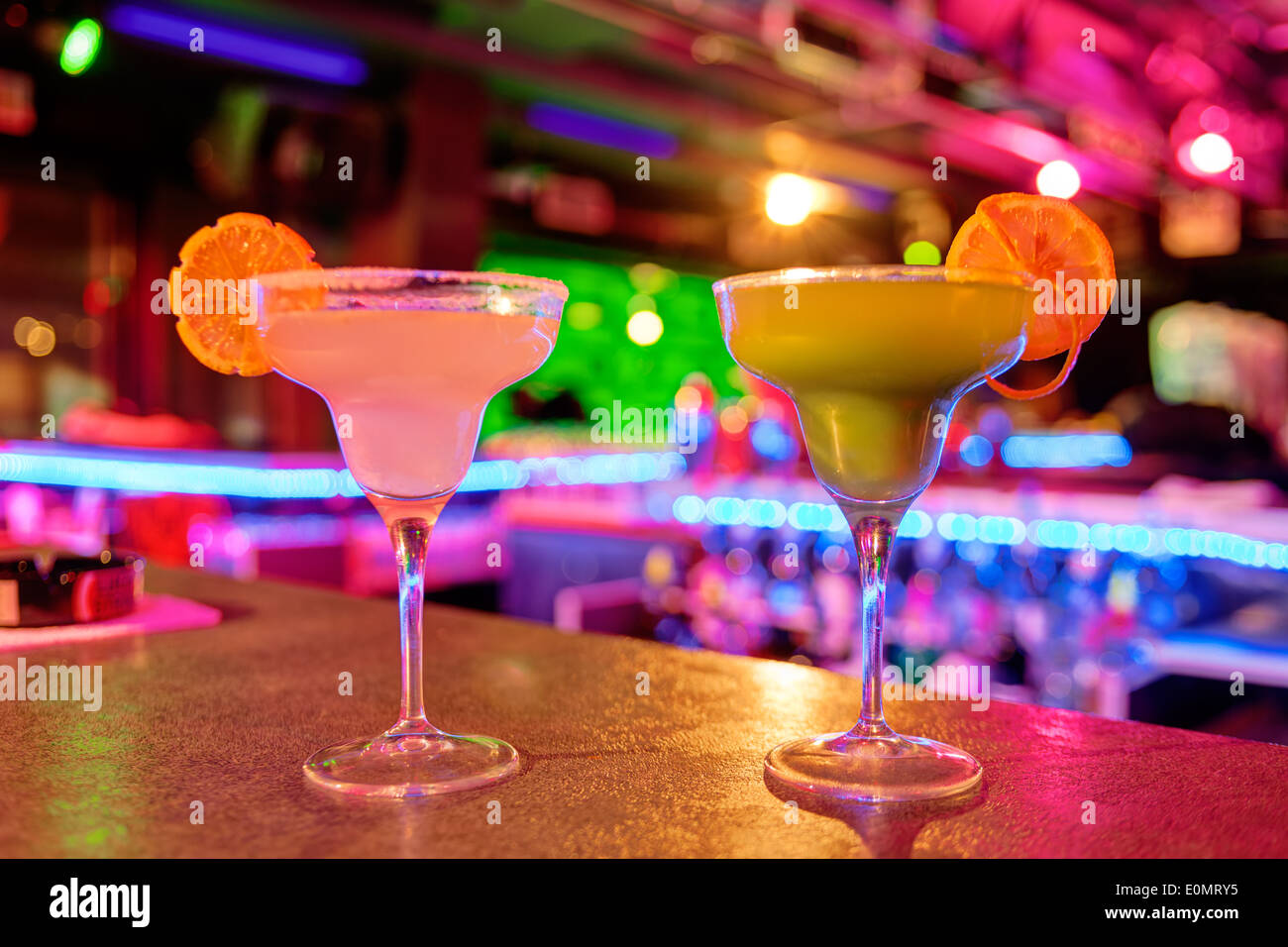 cocktail at bar in a night club with vivid colors Stock Photo - Alamy