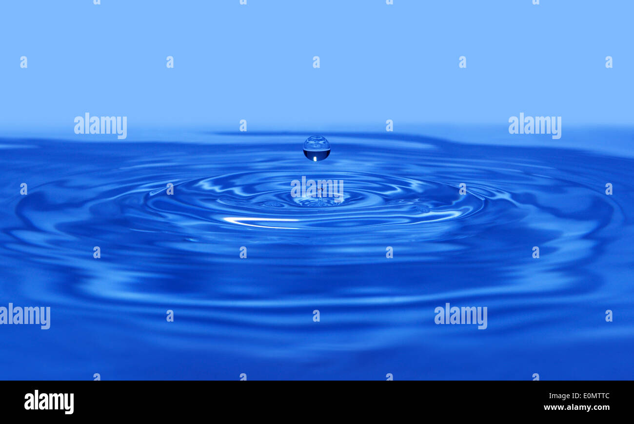 Blue water drop jumping out of the water Stock Photo - Alamy