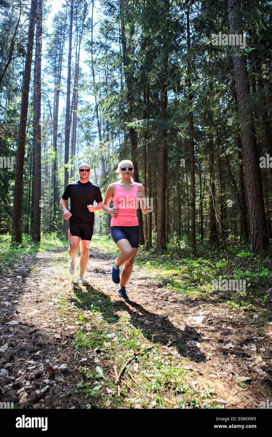 Man running through forest hi-res stock photography and images - Alamy