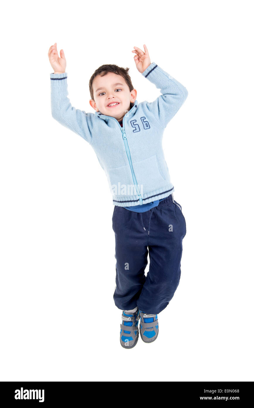 Young boy jumping isolated in white Stock Photo - Alamy