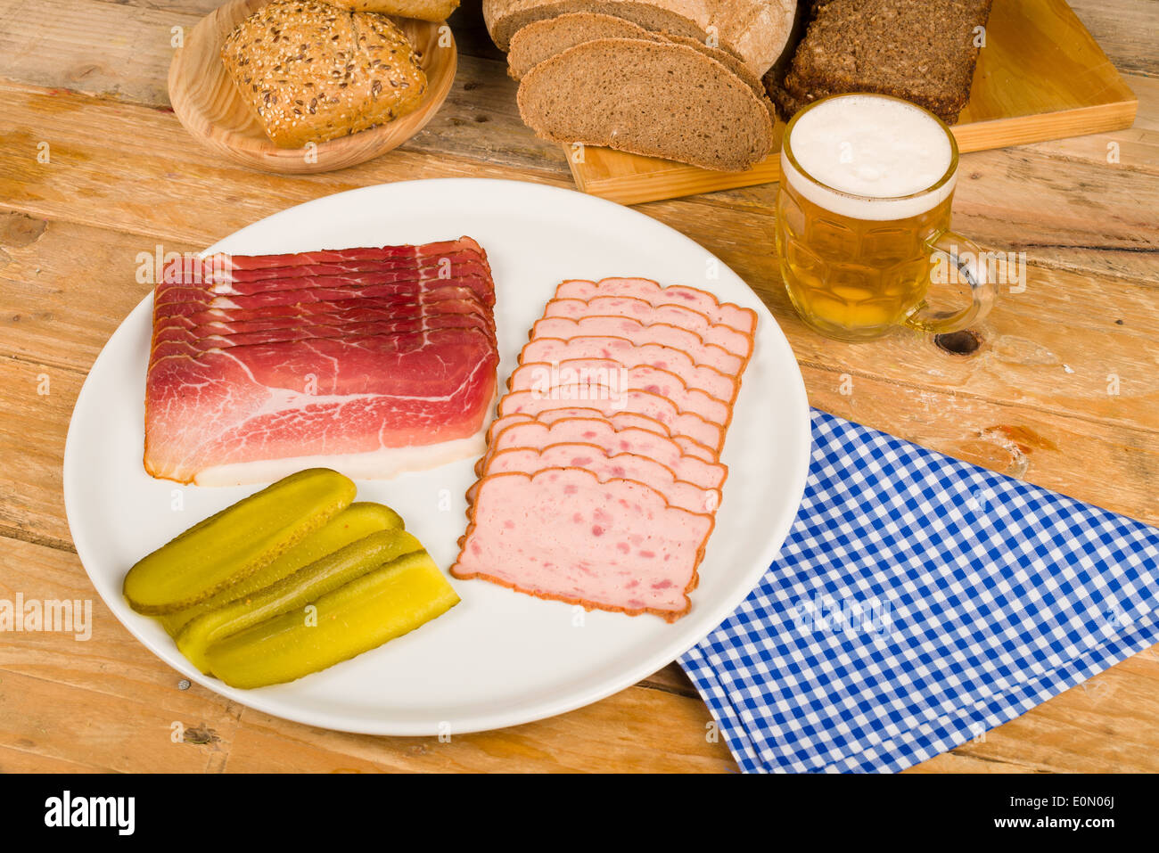 Cold meat, pickles, whole wheat bread and beer, a traditional German ...