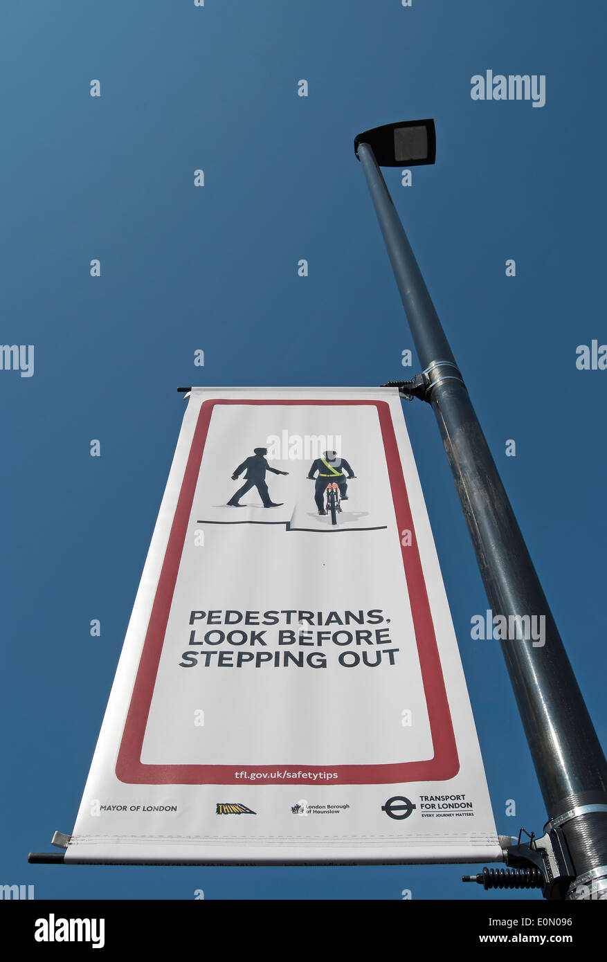 banner sign warning pedestrians to look before stepping out into the ...