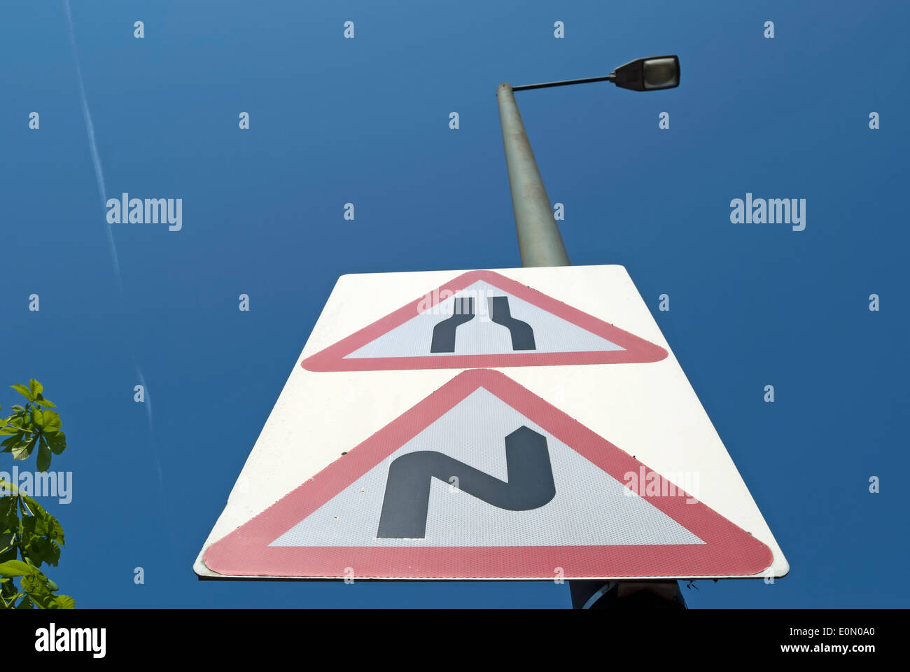 british road sign indicating a double bend, first bend to right, and a ...