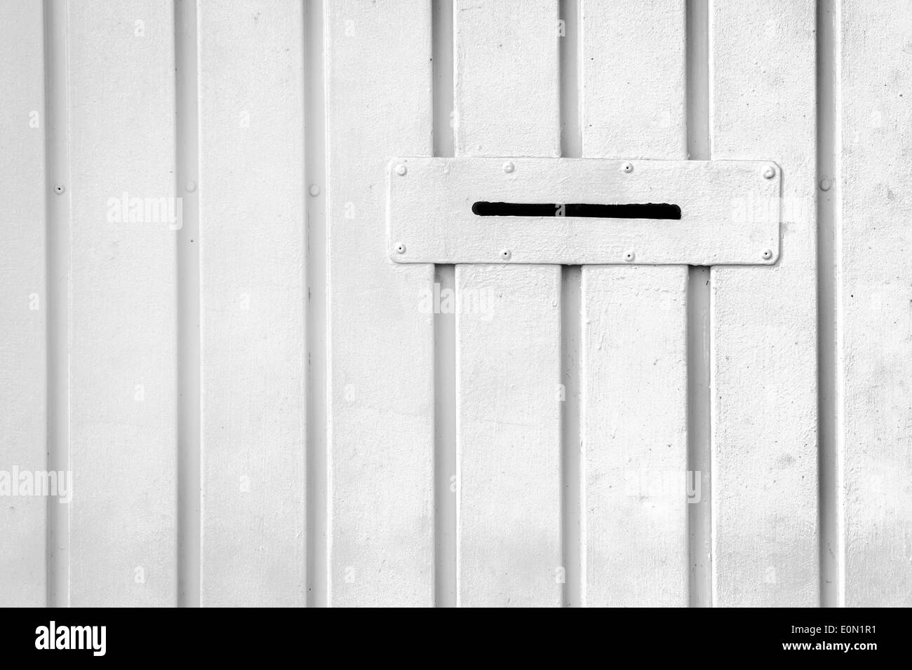 mailbox hole for letters on white wall Stock Photo - Alamy