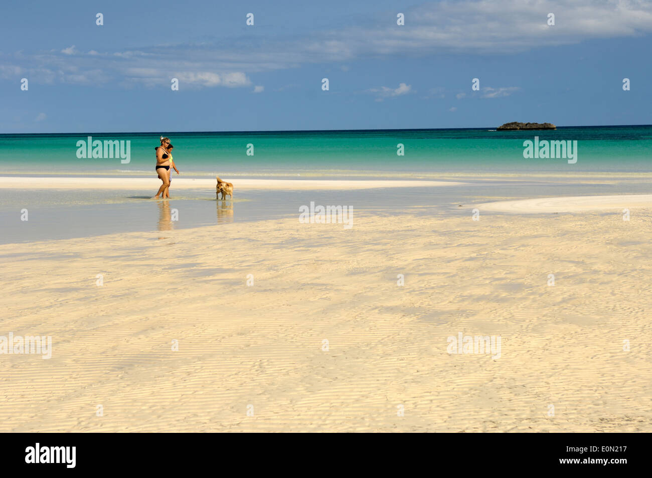 Walking on sandy Gold Rock Beach by sea Lucayan National Park Grand ...