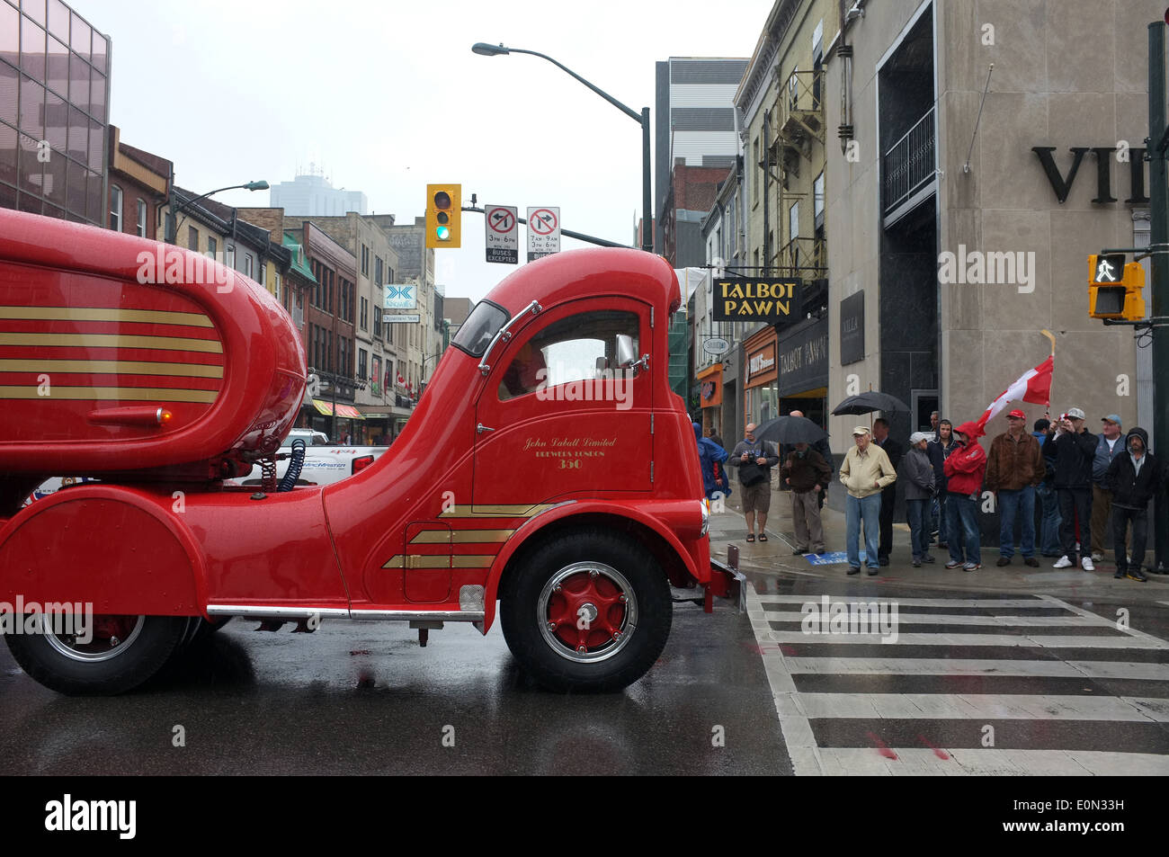 A vintage red Labatt beer lorry carrying the Memorial Cup trophy on the ...